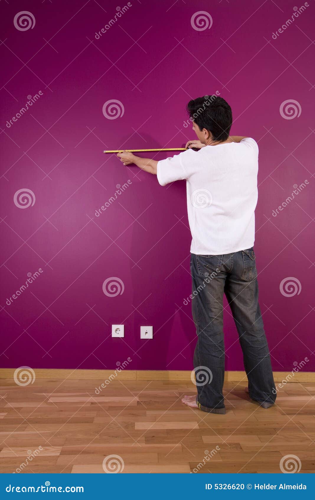 Men measuring wall stock photo. Image of adult, decorating - 5326620