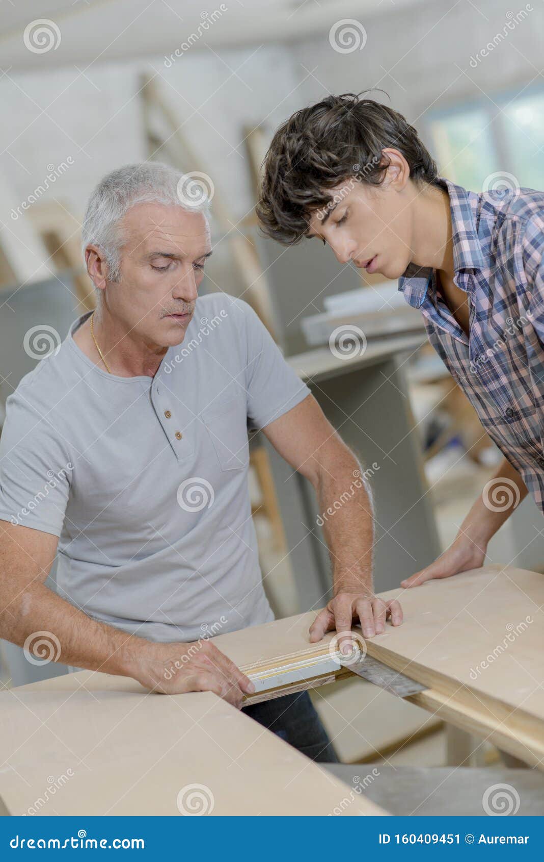 Men Measuring Wood Together Stock Image - Image of learning, passing ...