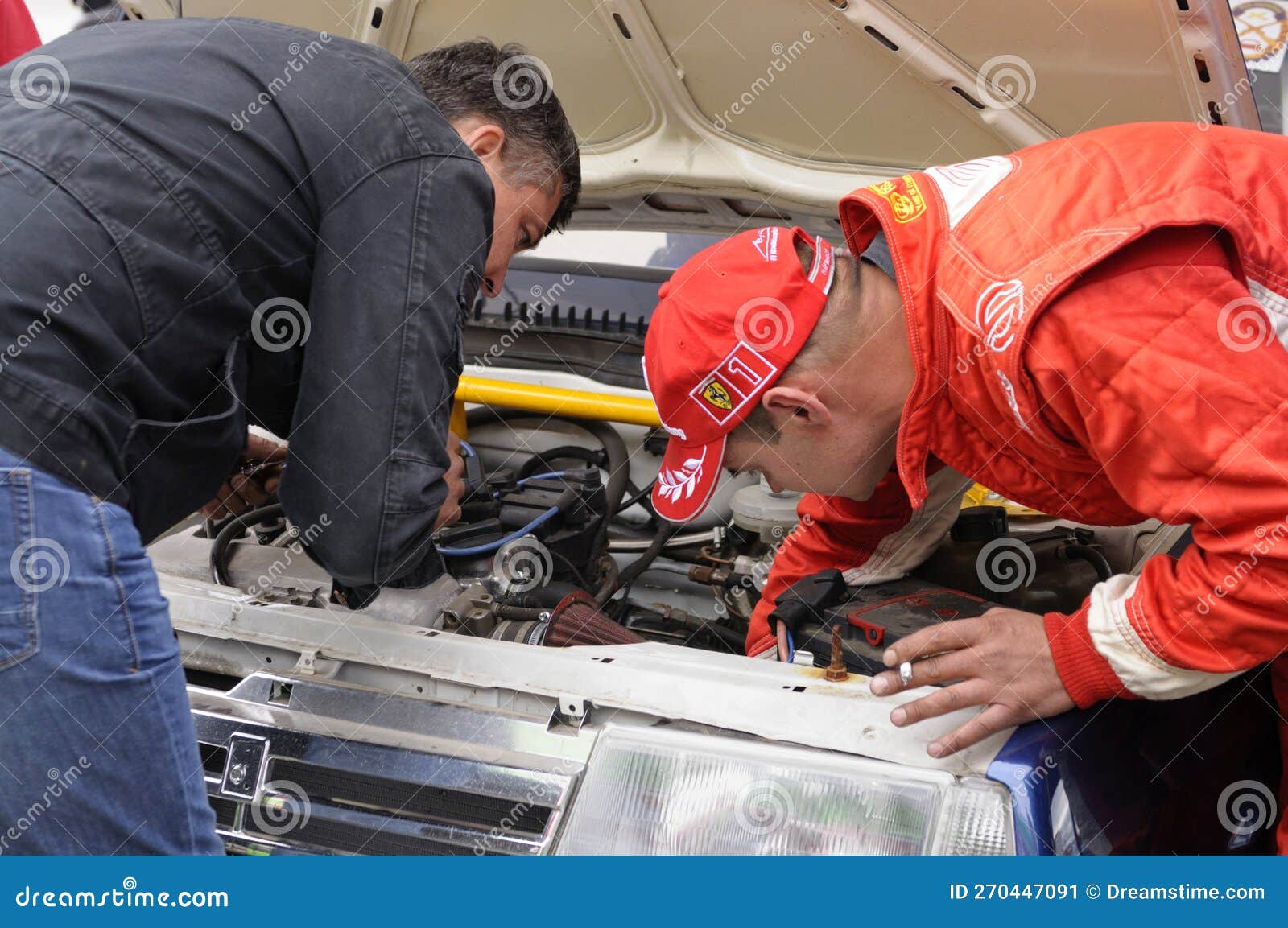 Men Mechanics Checking an Engine of a Car at a Pit Lane. Kyiv, Ukraine ...