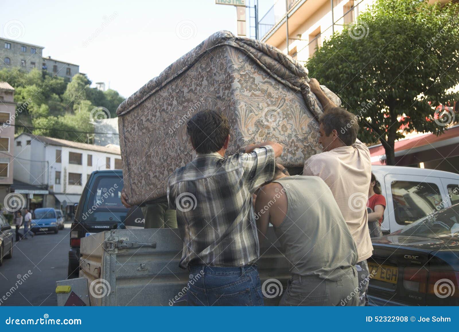 Men Moving Couch in Ainsa, Huesca, Spain in Pyrenees Mountains ...