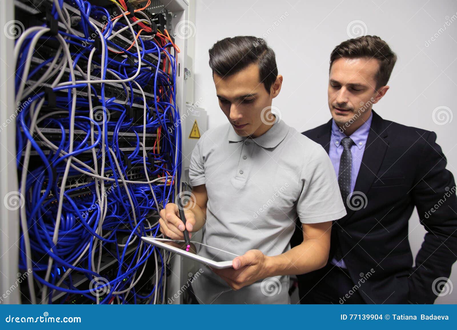 Men in network server room stock photo. Image of engineer - 77139904