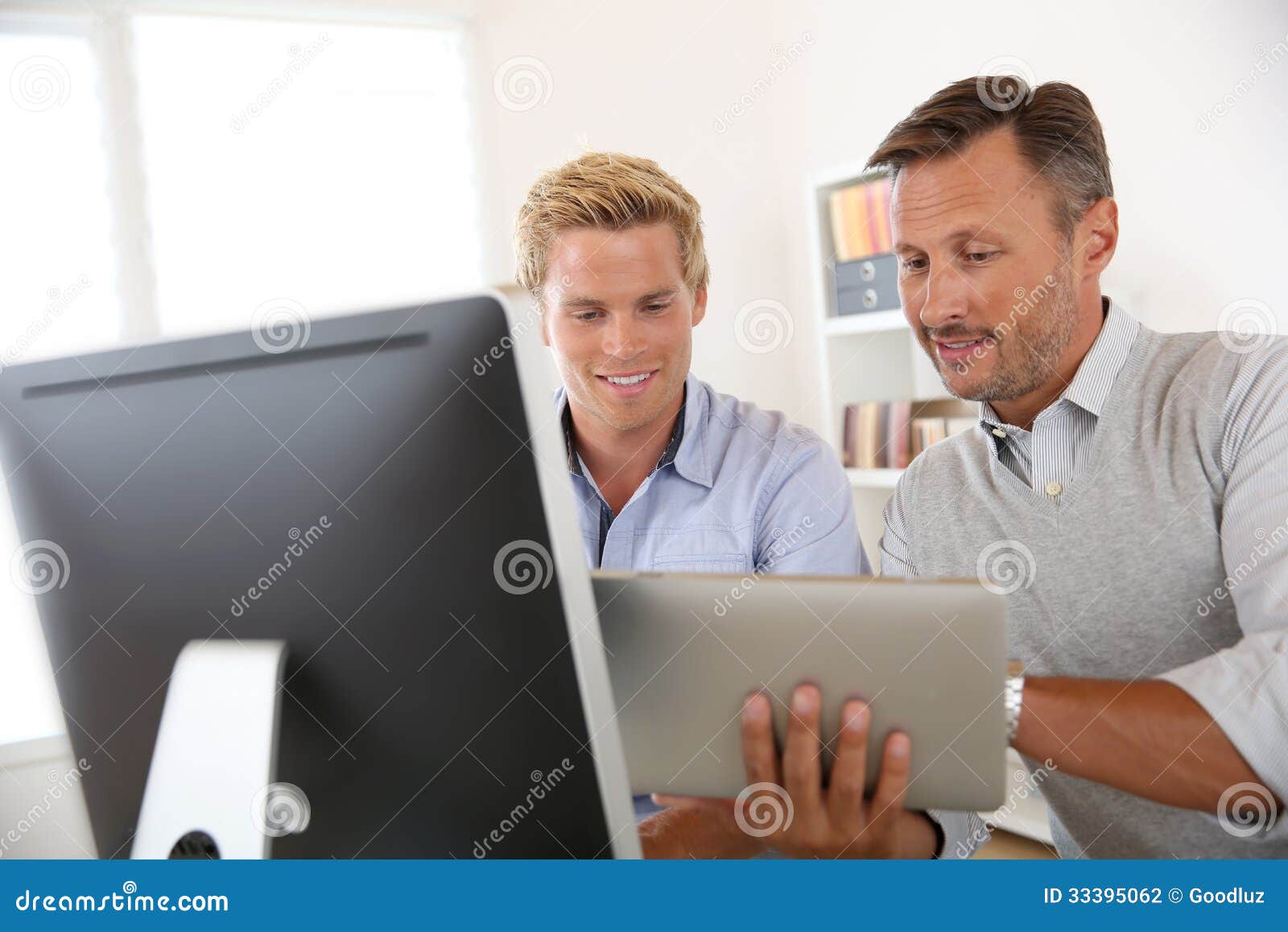 Men in Office Working Together on Project Stock Photo - Image of years ...