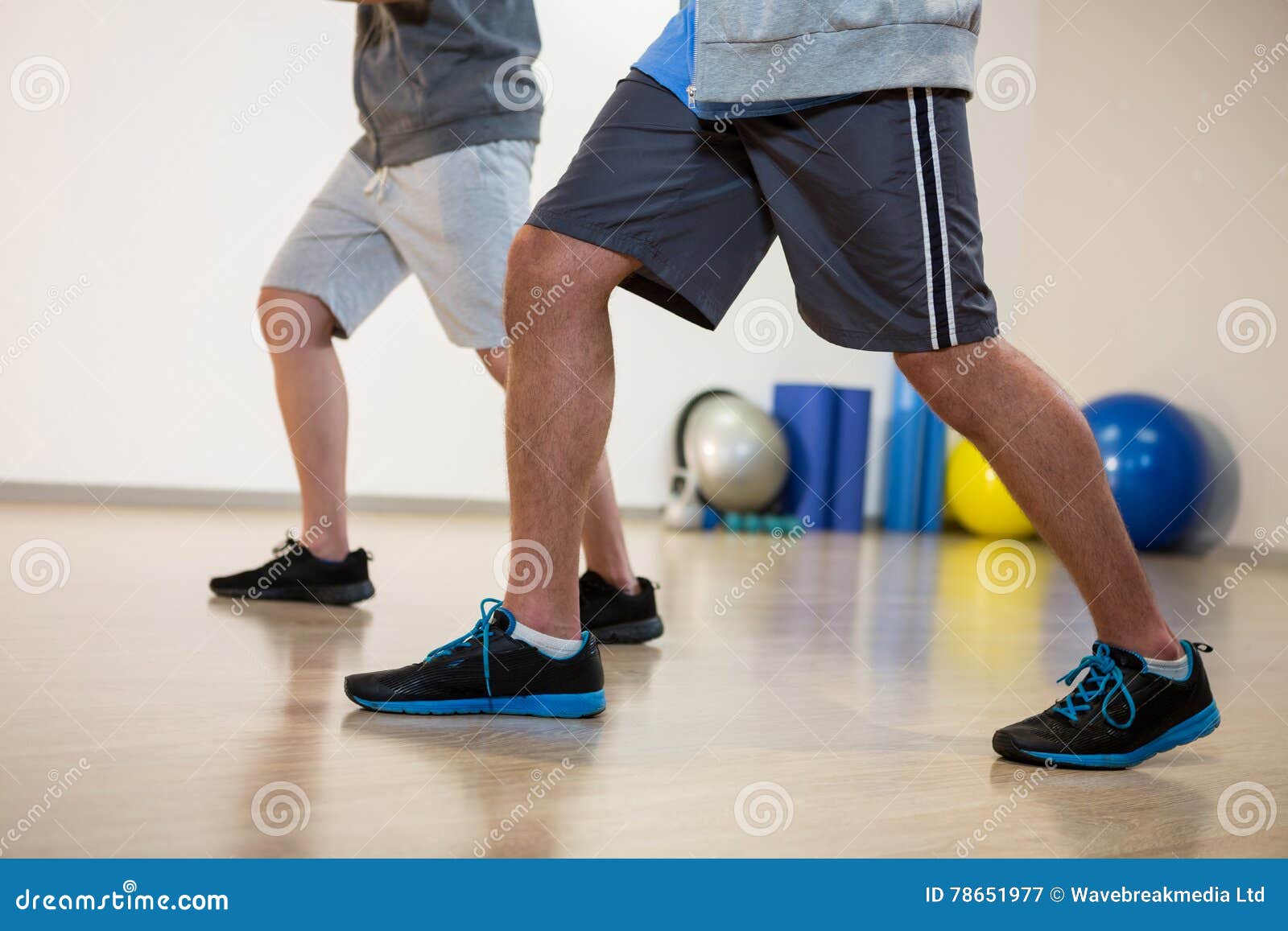 Men Performing Stretching Exercise Stock Image - Image of sportswear ...