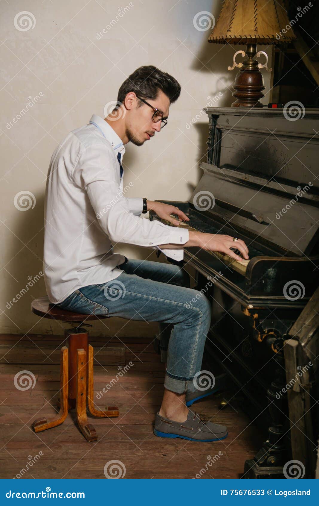 The men playing the piano stock image. Image of concert - 75676533