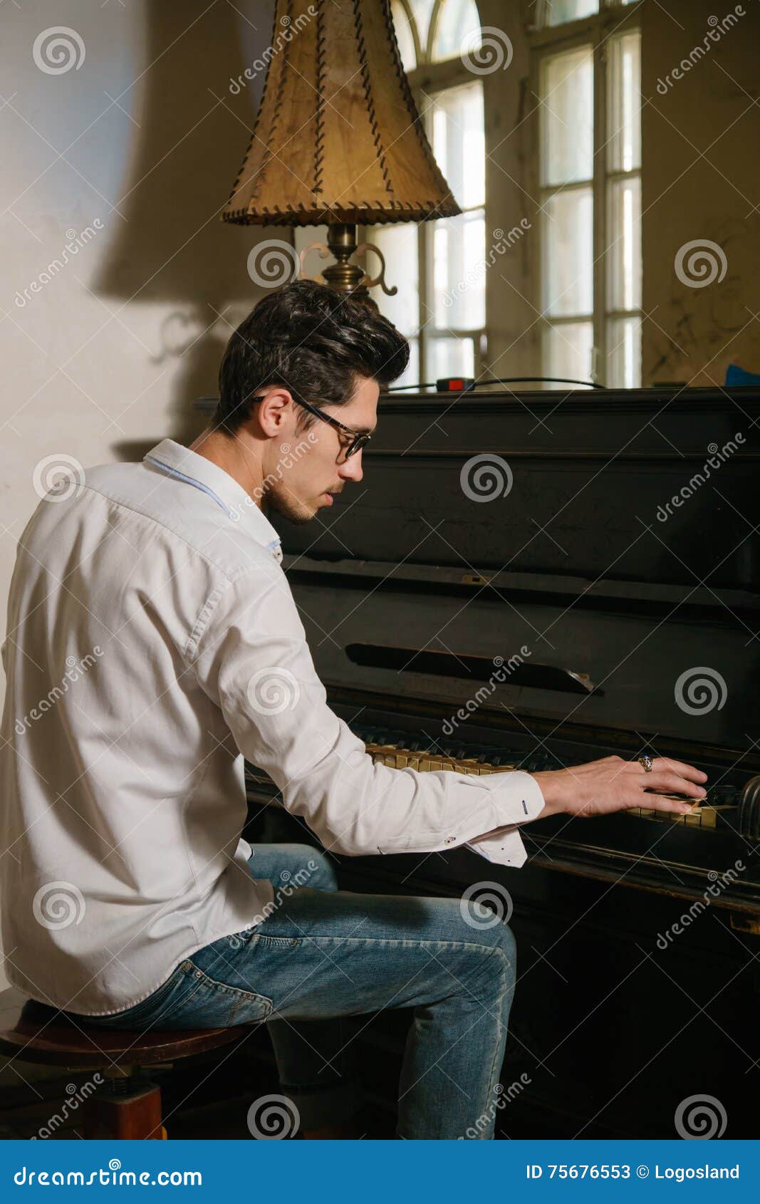 The men playing the piano stock image. Image of people - 75676553