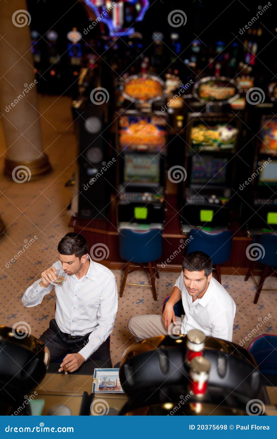Men Playing the Slot Machine Stock Photo - Image of arcade, hand: 20375698