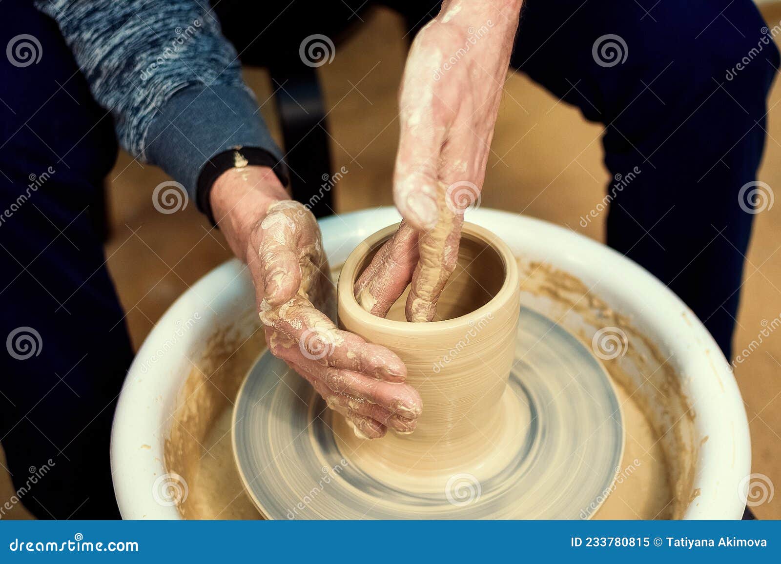 The Men Potters Hands Form By A Clay Pot On A Potters Wheel. The Potter ...