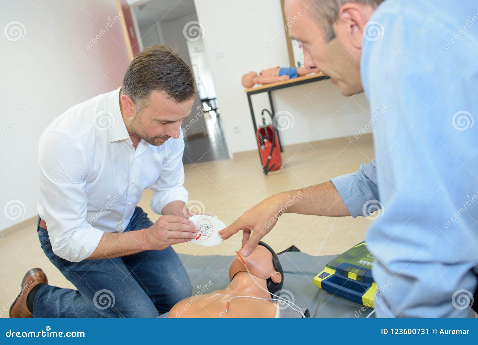 Men practicing first aid stock image. Image of young - 123600731