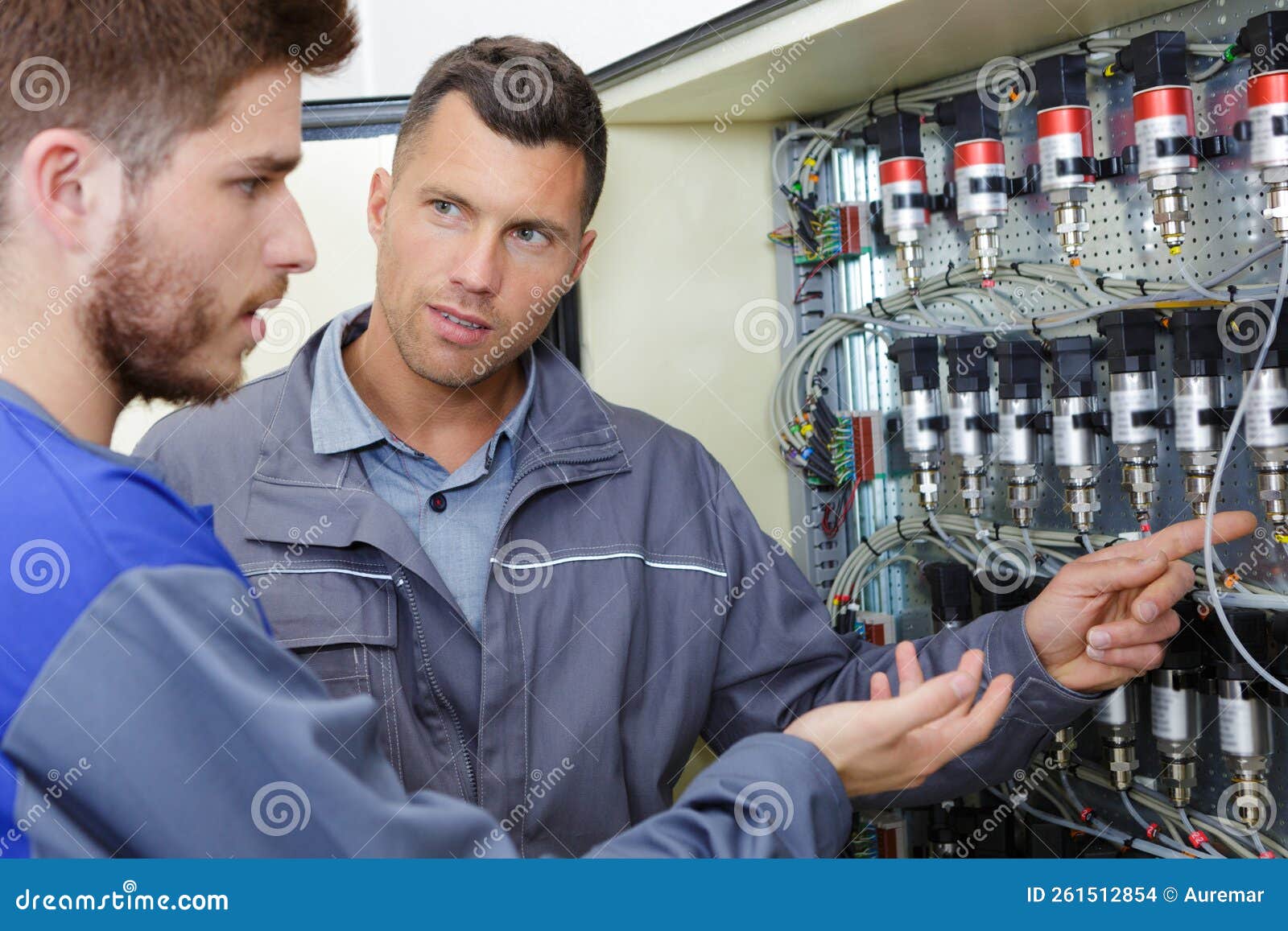 Men during Precision Work on Production Line Stock Photo - Image of ...