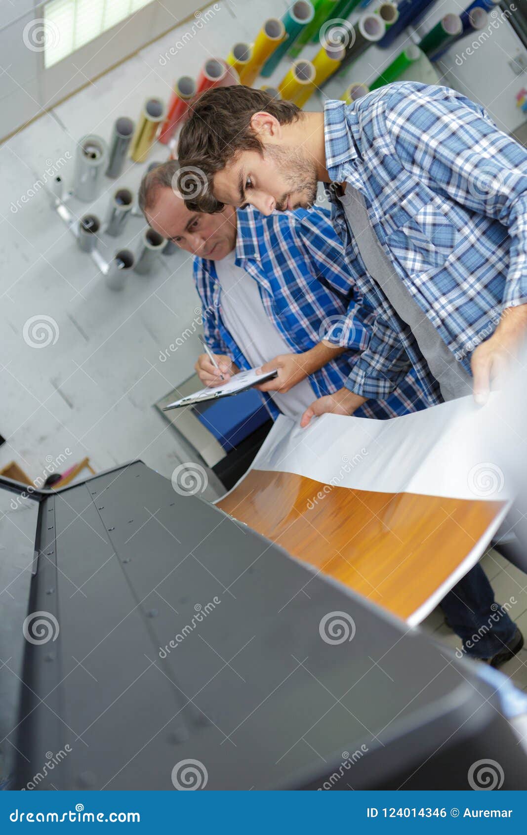 Men at printing works stock photo. Image of publishing - 124014346