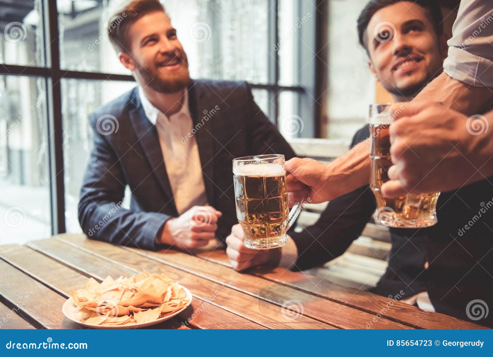 Men at the pub stock image. Image of casual, adult, friendship - 85654723