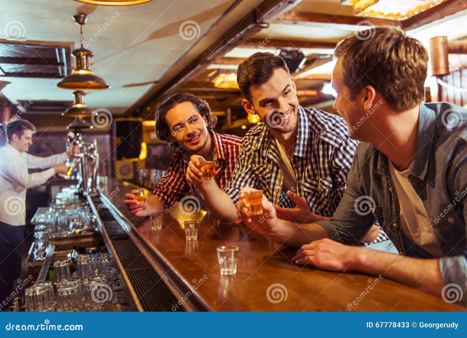 Men in pub stock image. Image of holding, leisure, casual - 67778433