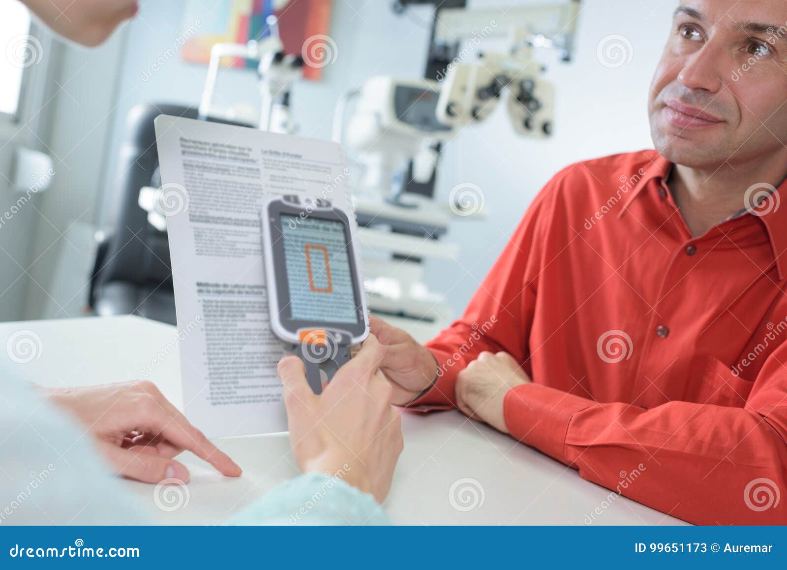 Men Reading Document with Reader in Office Stock Image - Image of ...