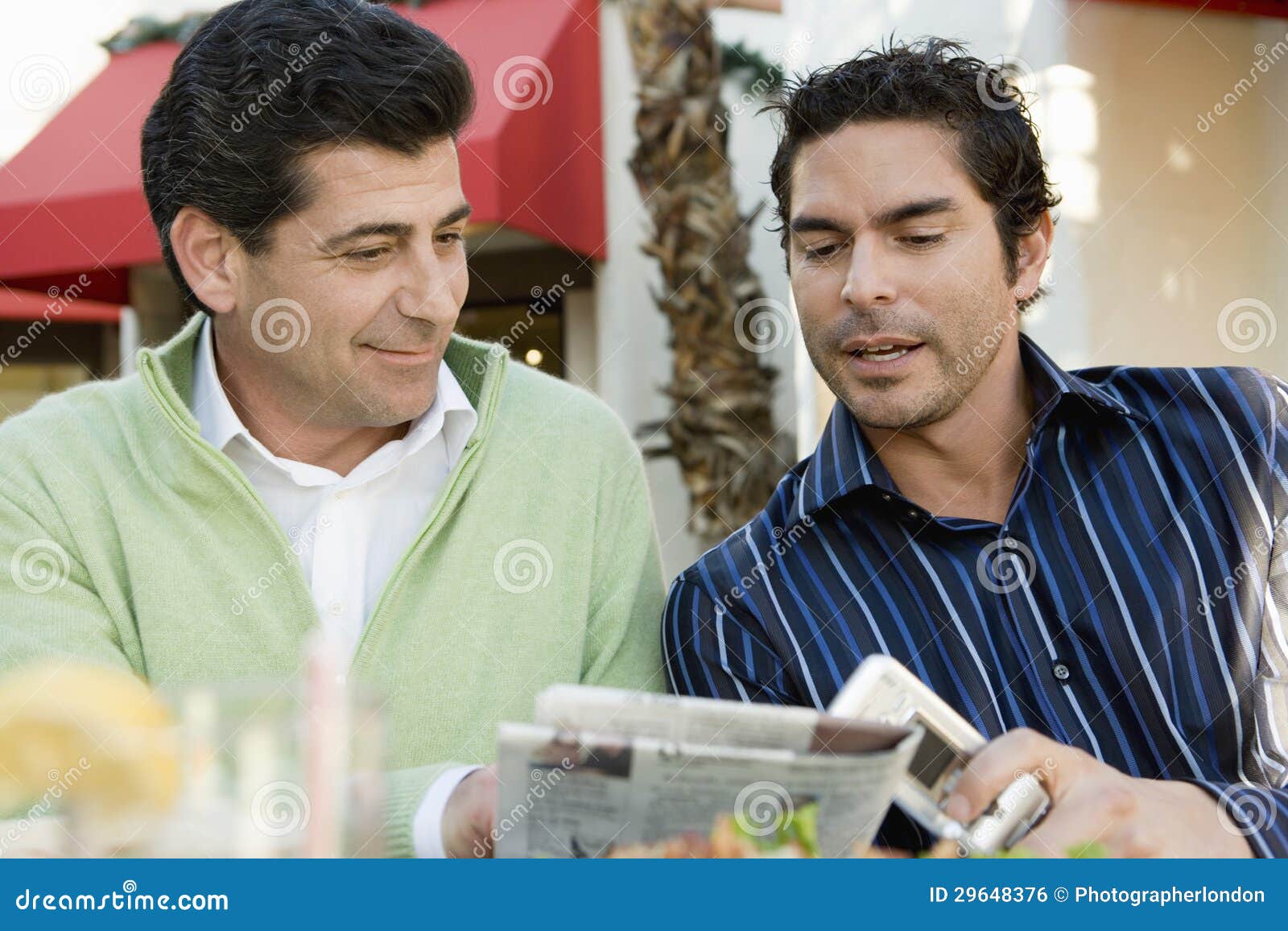 Men Reading Newspaper at Cafe Stock Photo - Image of looking ...