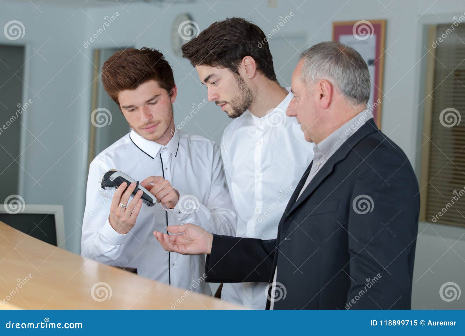 Men Receptionist Registration at Reception Counter Checking in Stock ...