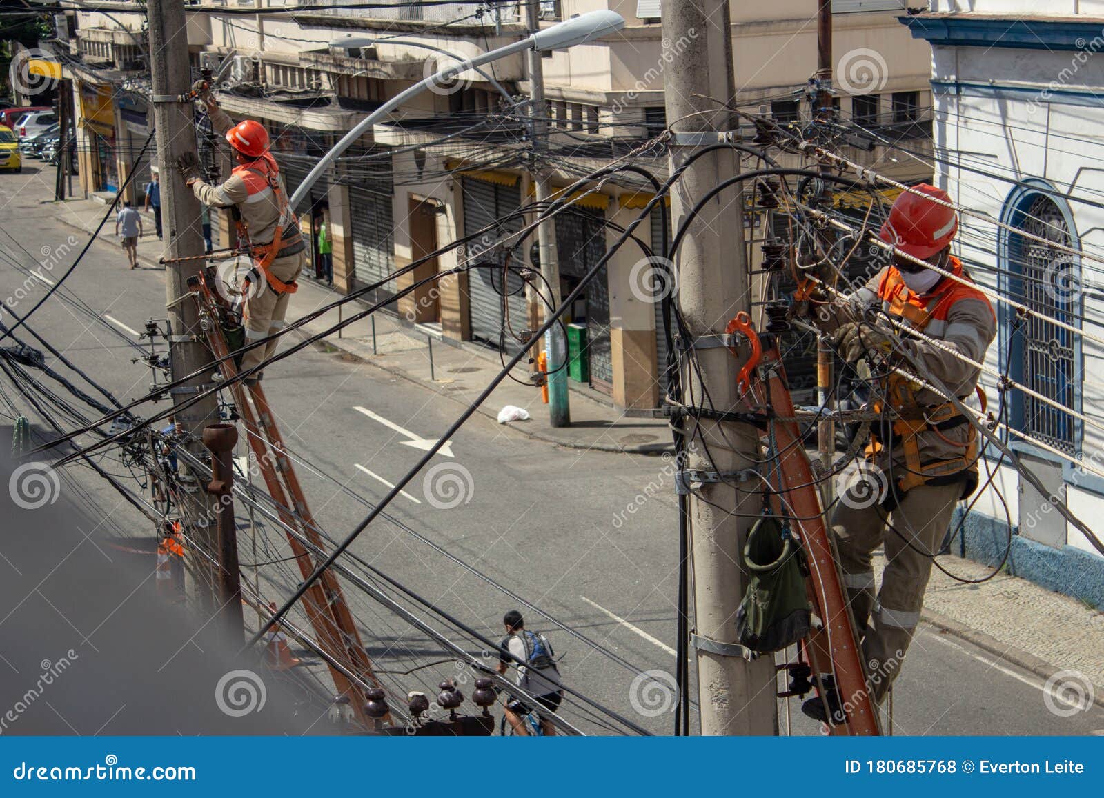Men Repairing Electrical Grid Wires Using Masks because of COVID-19 ...