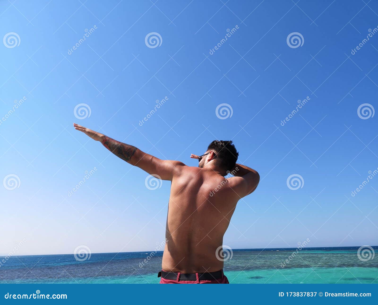 Men`s Back Against the Backdrop of a Water Plexus of the Sea, Relax and ...