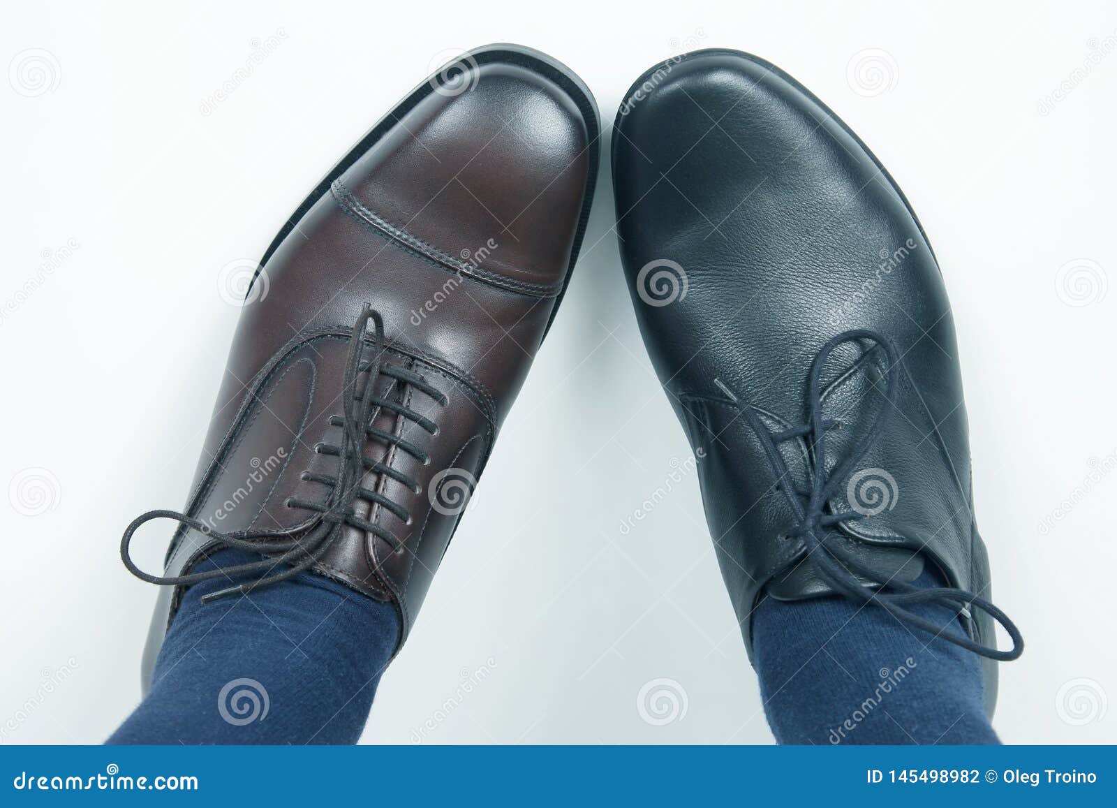 Men`s Feet in Different Color Classic Shoes on White Background Stock ...