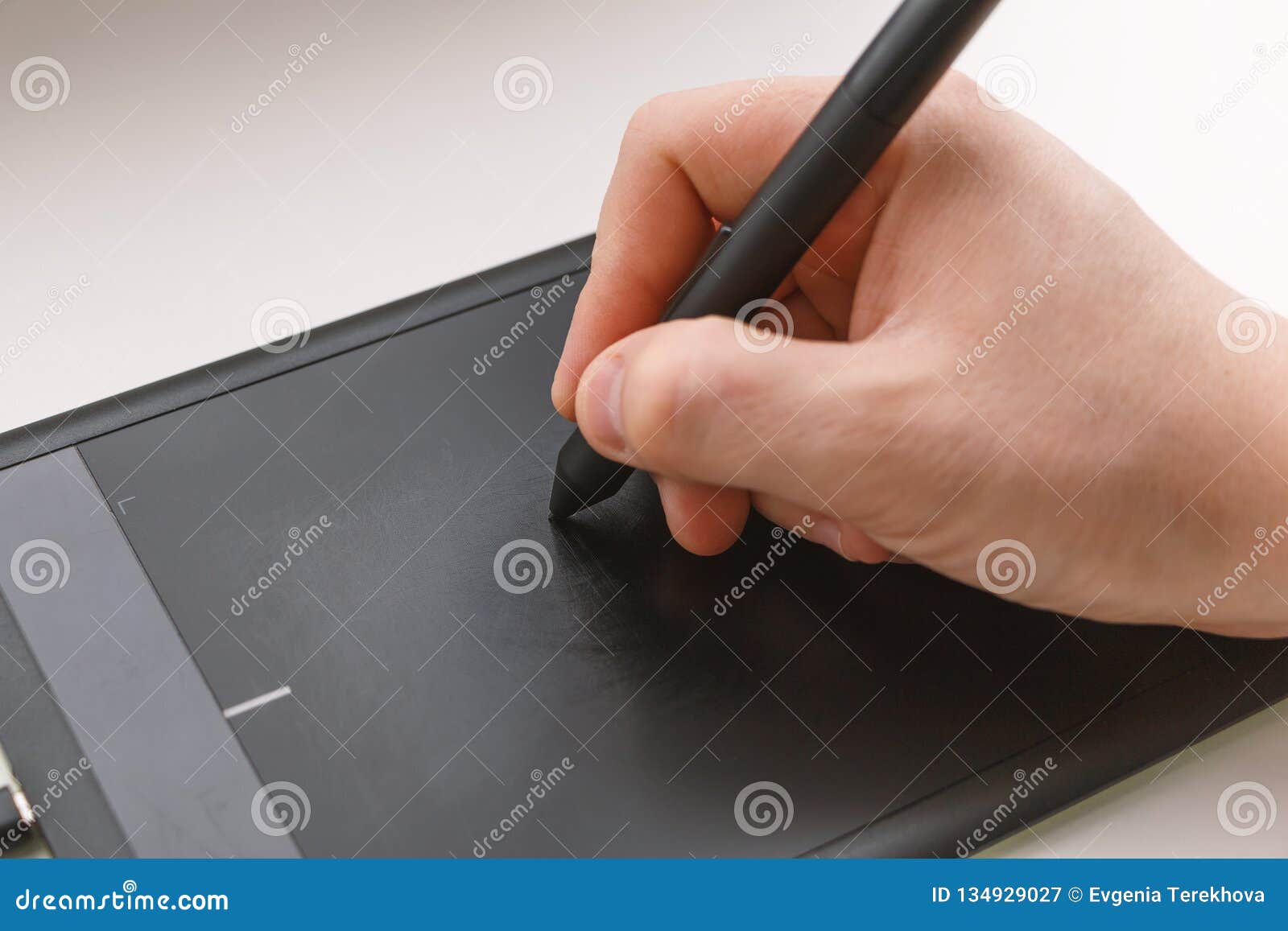 Men`s Hand Draws on a Graphics Tablet Using a Stylus Stock Image ...