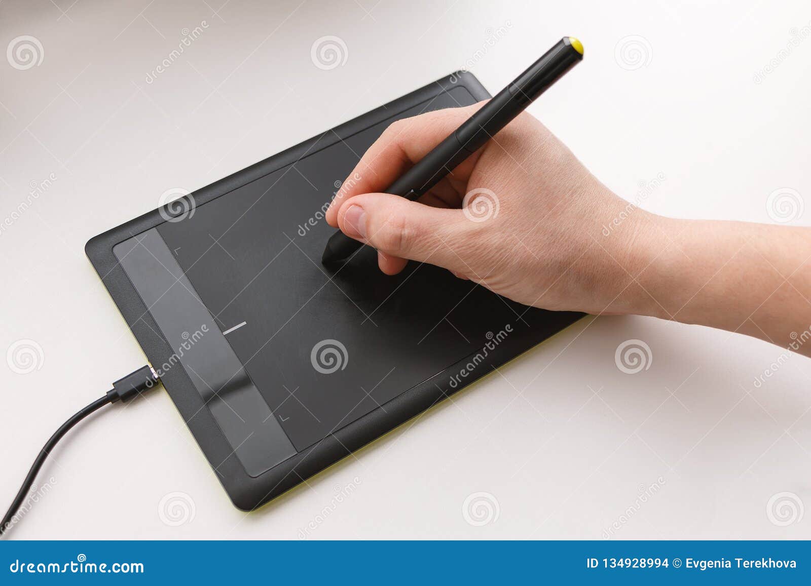 Men`s Hand Draws on a Graphics Tablet Using a Stylus Stock Photo ...