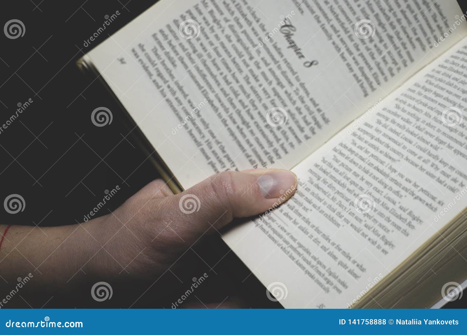 Men& X27;s Hand Holds an Open Book Ready for Reading Stock Photo ...