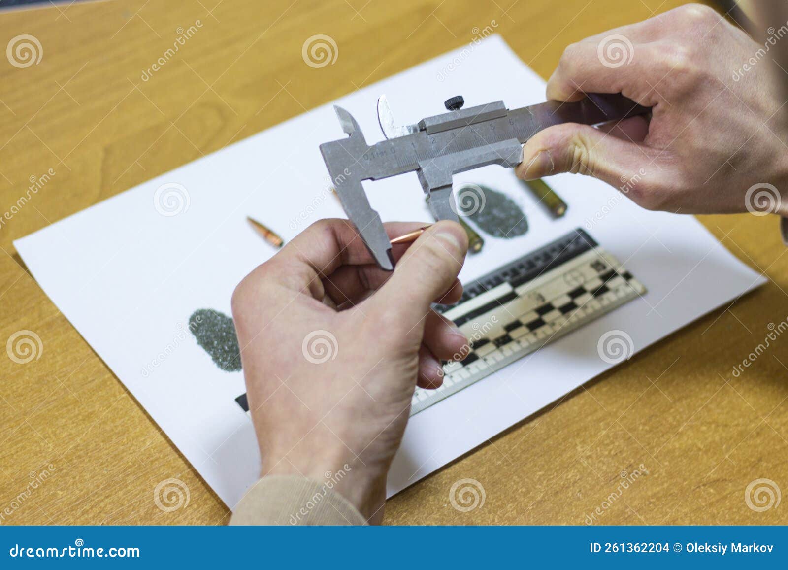 Men& X27;s Hands with a Caliper Measure a Bullet Stock Photo - Image of ...