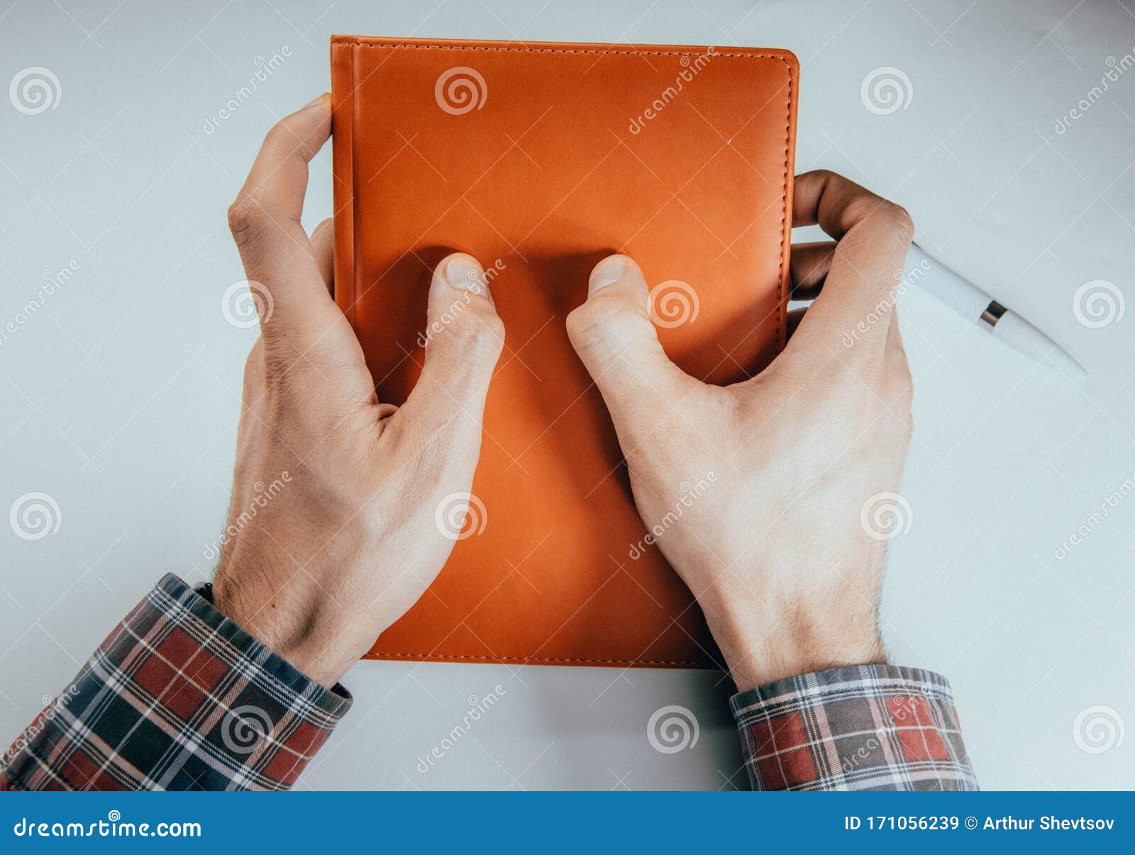 Men`s Hands, Forearm Hold a Pen, Notebook, Smartphone. Hands Write in ...