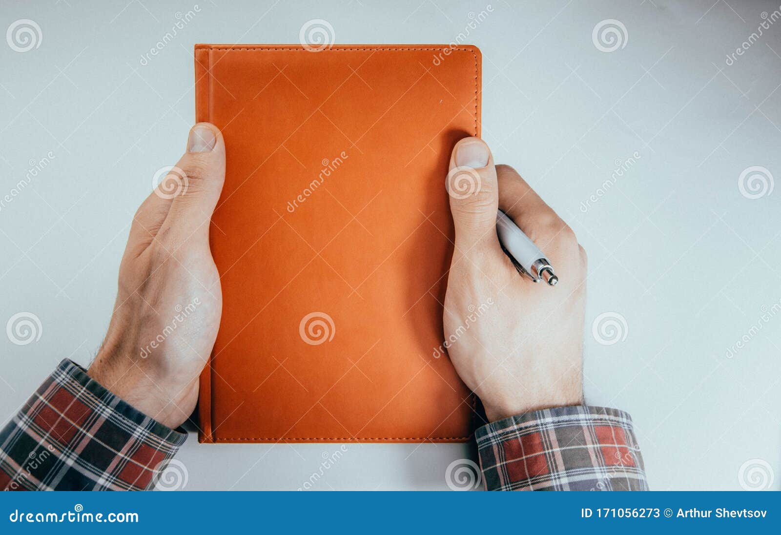 Men`s Hands, Forearm Hold a Pen, Notebook, Smartphone. Hands Write in ...
