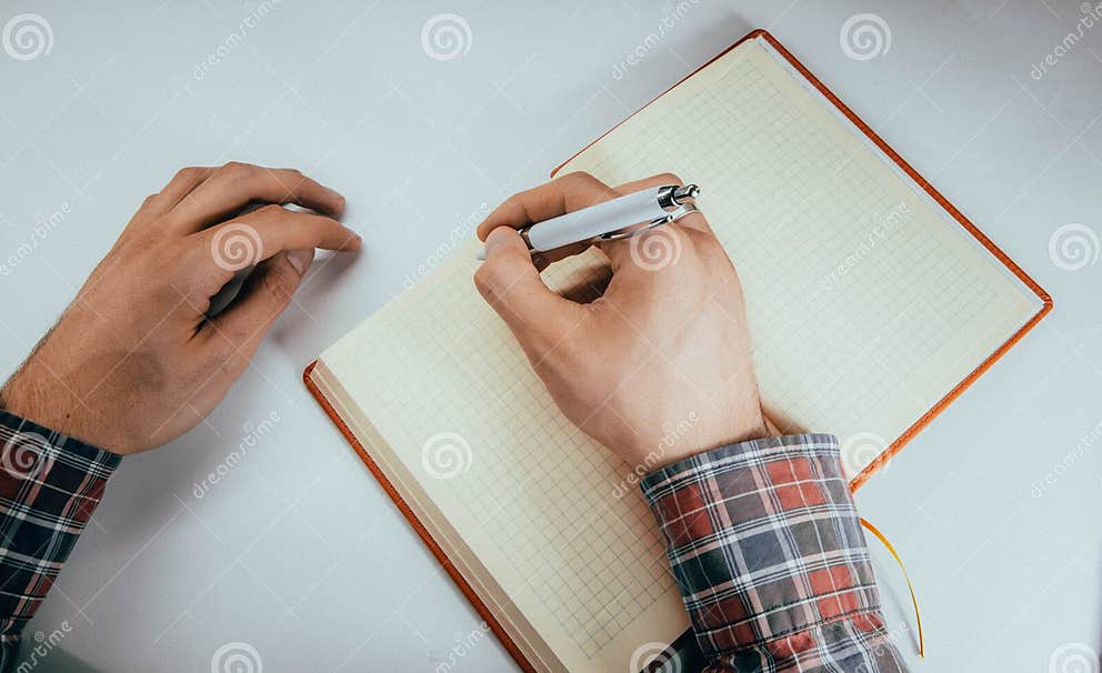 Men`s Hands, Forearm Hold a Pen, Notebook, Smartphone. Hands Write in ...