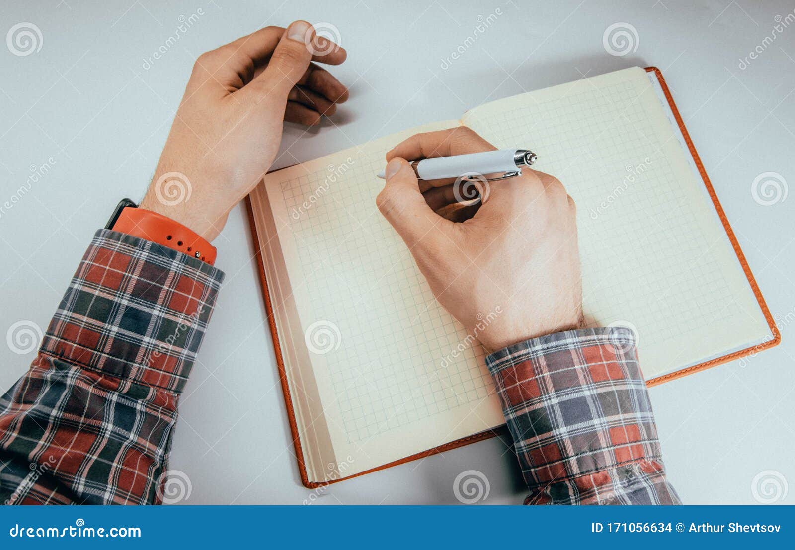 Men`s Hands, Forearm Hold a Pen, Notebook, Smartphone. Hands Write in ...