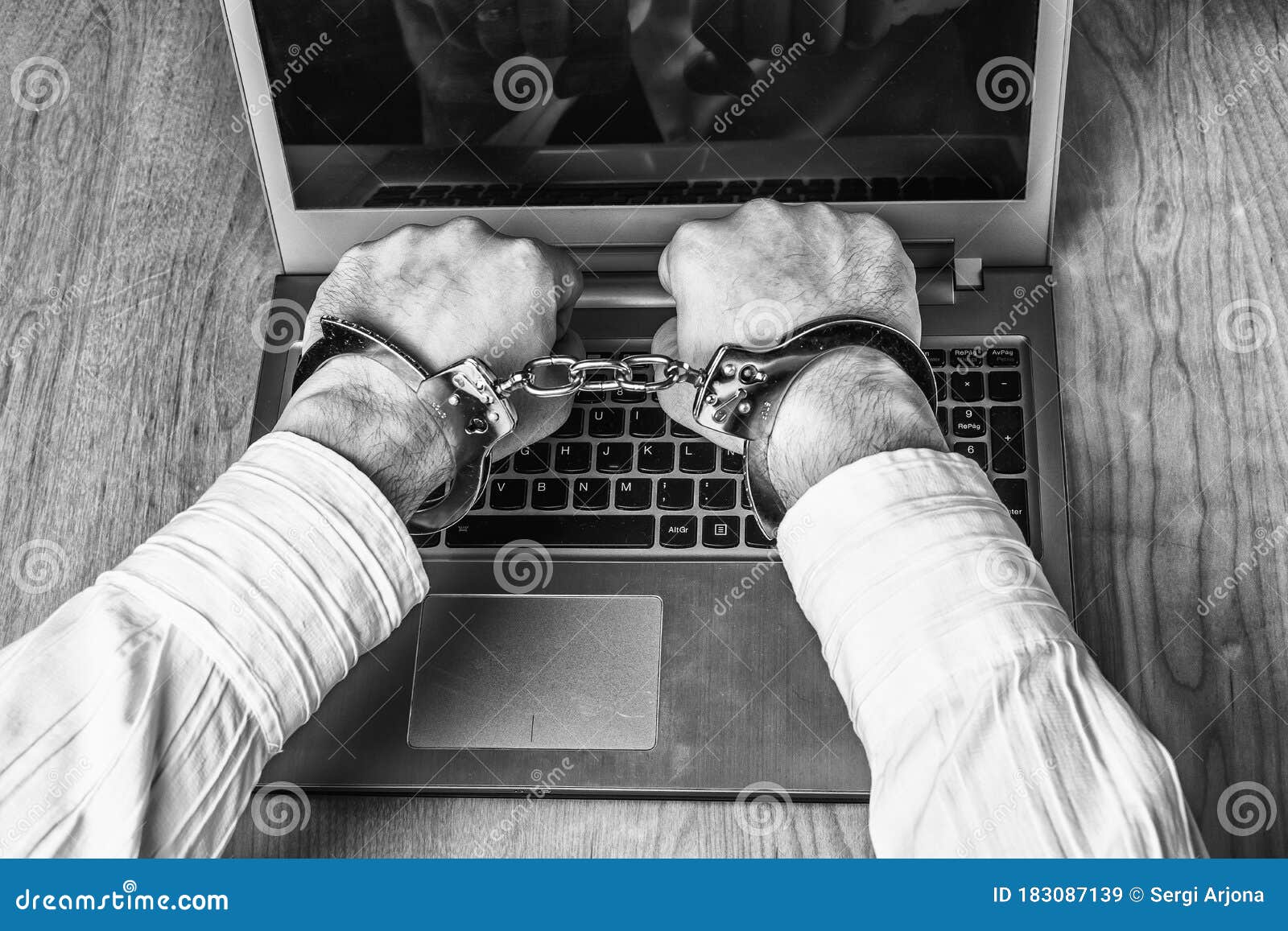 Men`s Hands Handcuffed on a Laptop. Stock Image - Image of identity ...