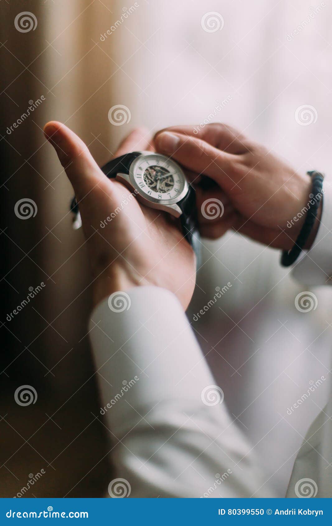 Men`s Hands Holding and Winding Up Mechanical Watch Stock Photo - Image ...