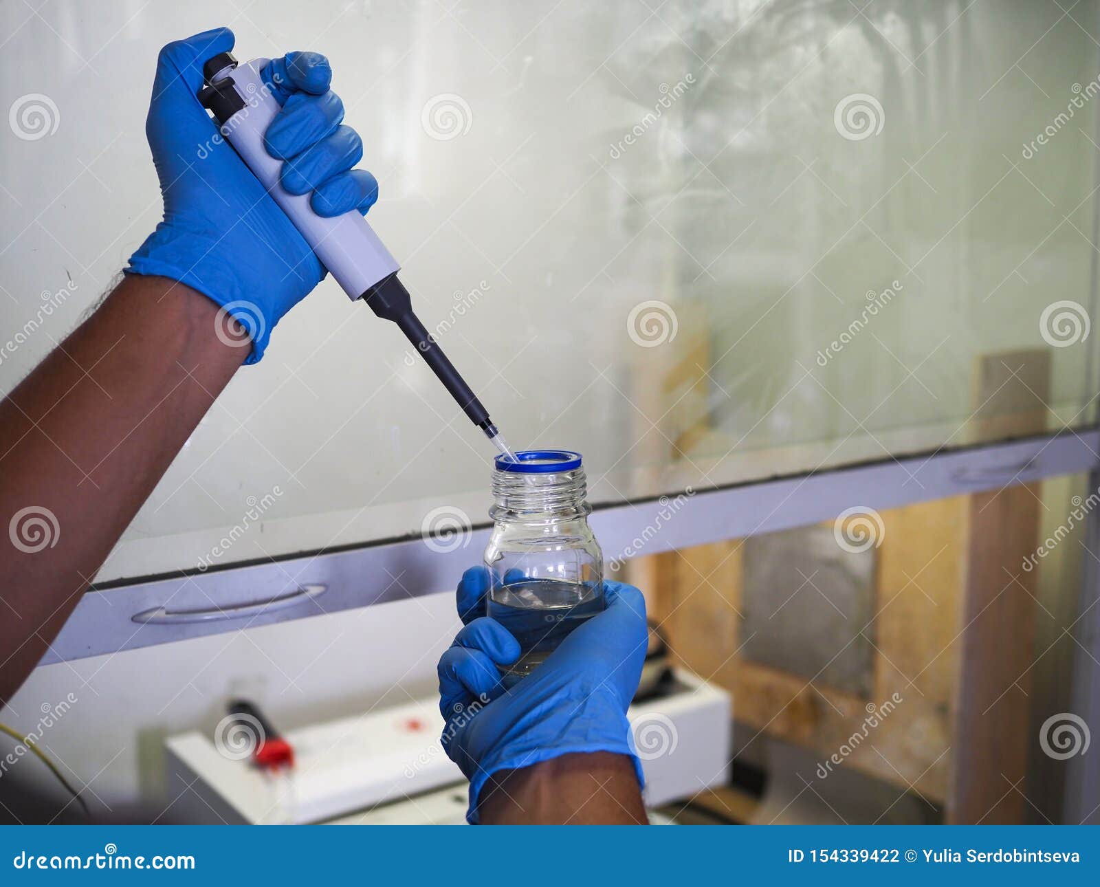 Hands Of Scientists Are Working On Research.Bacteria In Agar Sheets ...