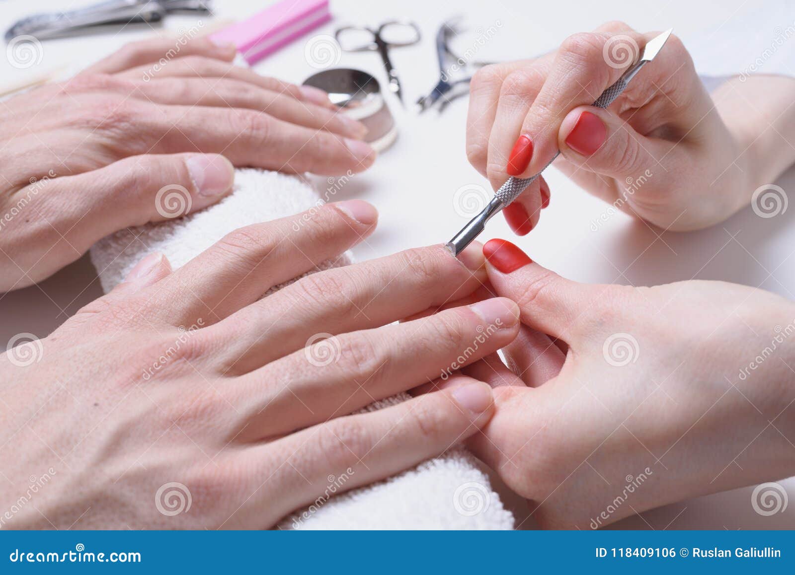 Men`s Manicure. Hands of the Beautician Treated Cuticle of Male Hands ...