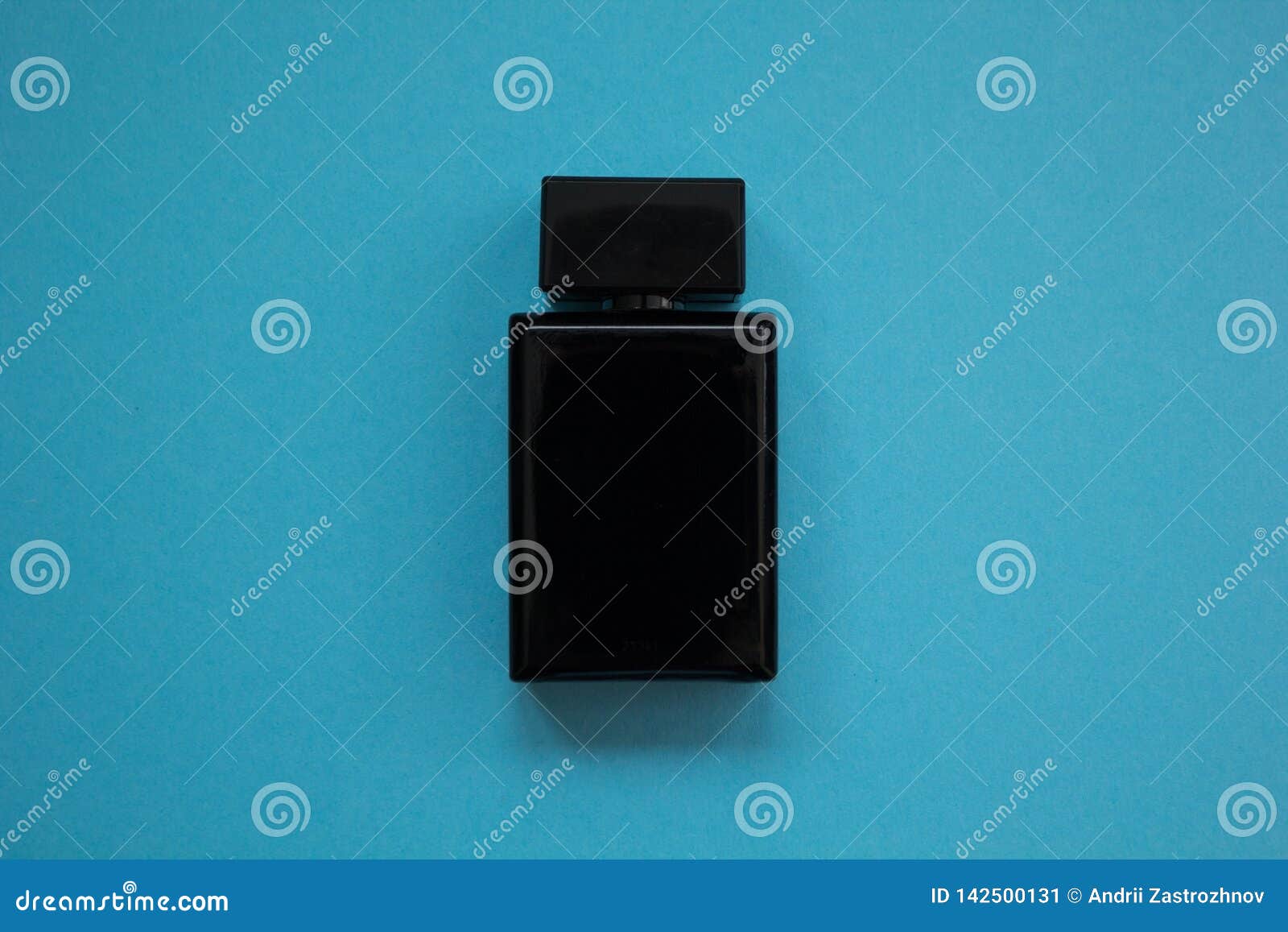 Men`s Perfume in Beautiful Black Bottle on a Blue Background Stock ...
