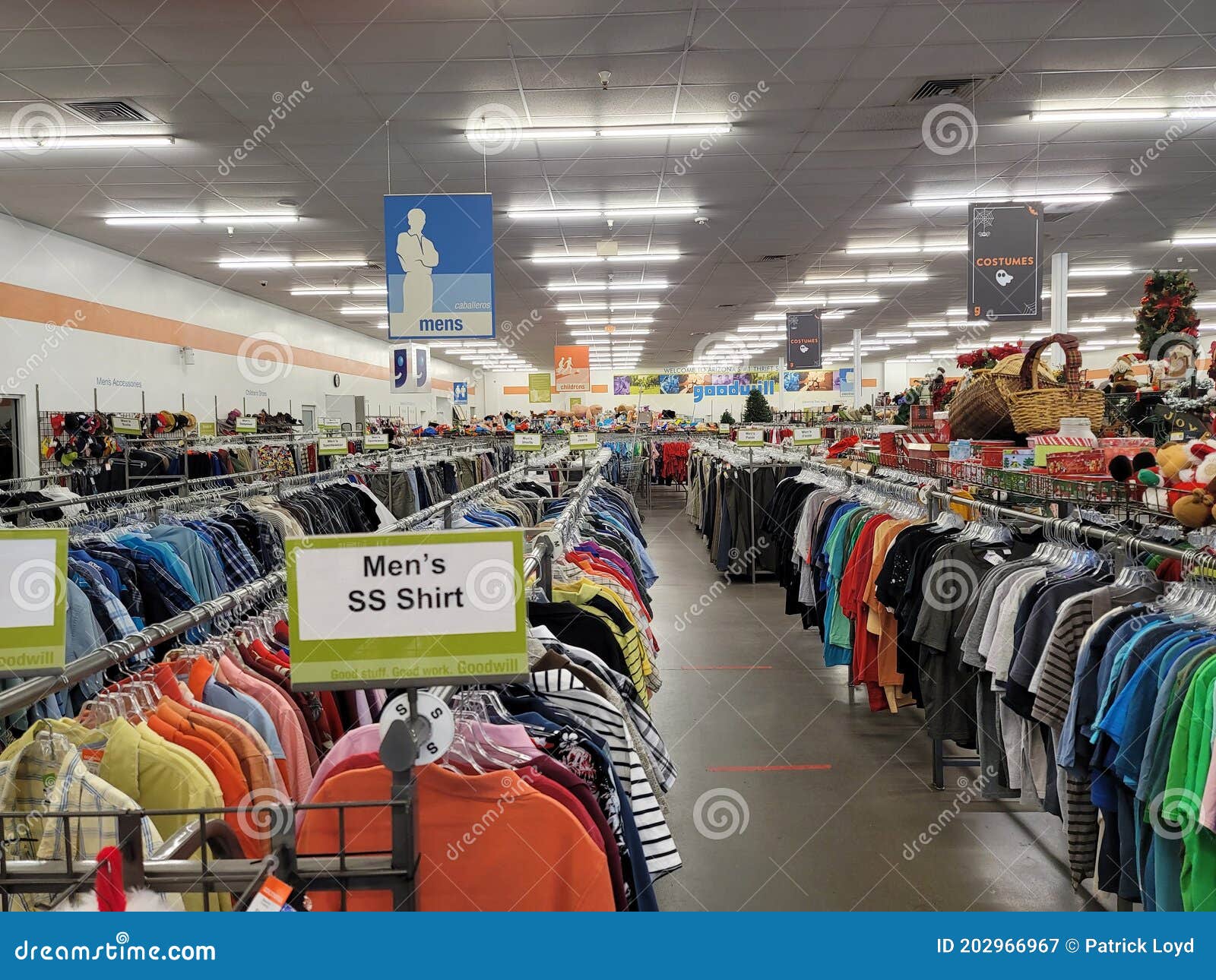 Men& X27;s T-Shirt Racks Editorial Photography - Image of racks, person ...