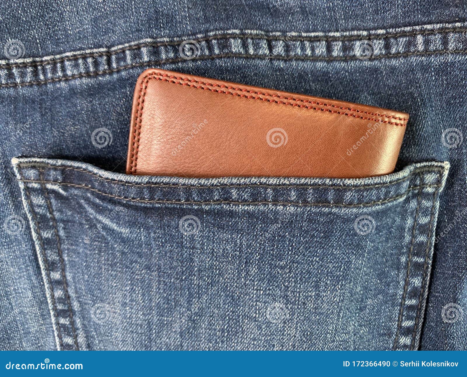 Men`s Wallet in the Back Pocket of Jeans. Leather Brown Wallet in Blue ...