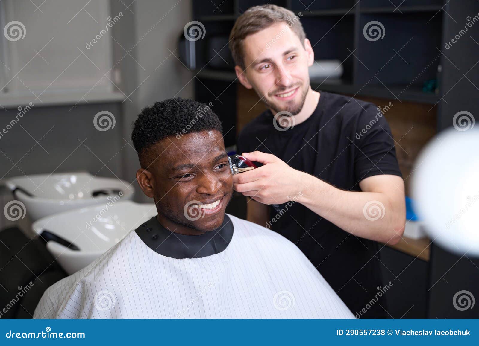 Men Sat in Front of the Mirror in the Barbershop Stock Photo - Image of ...