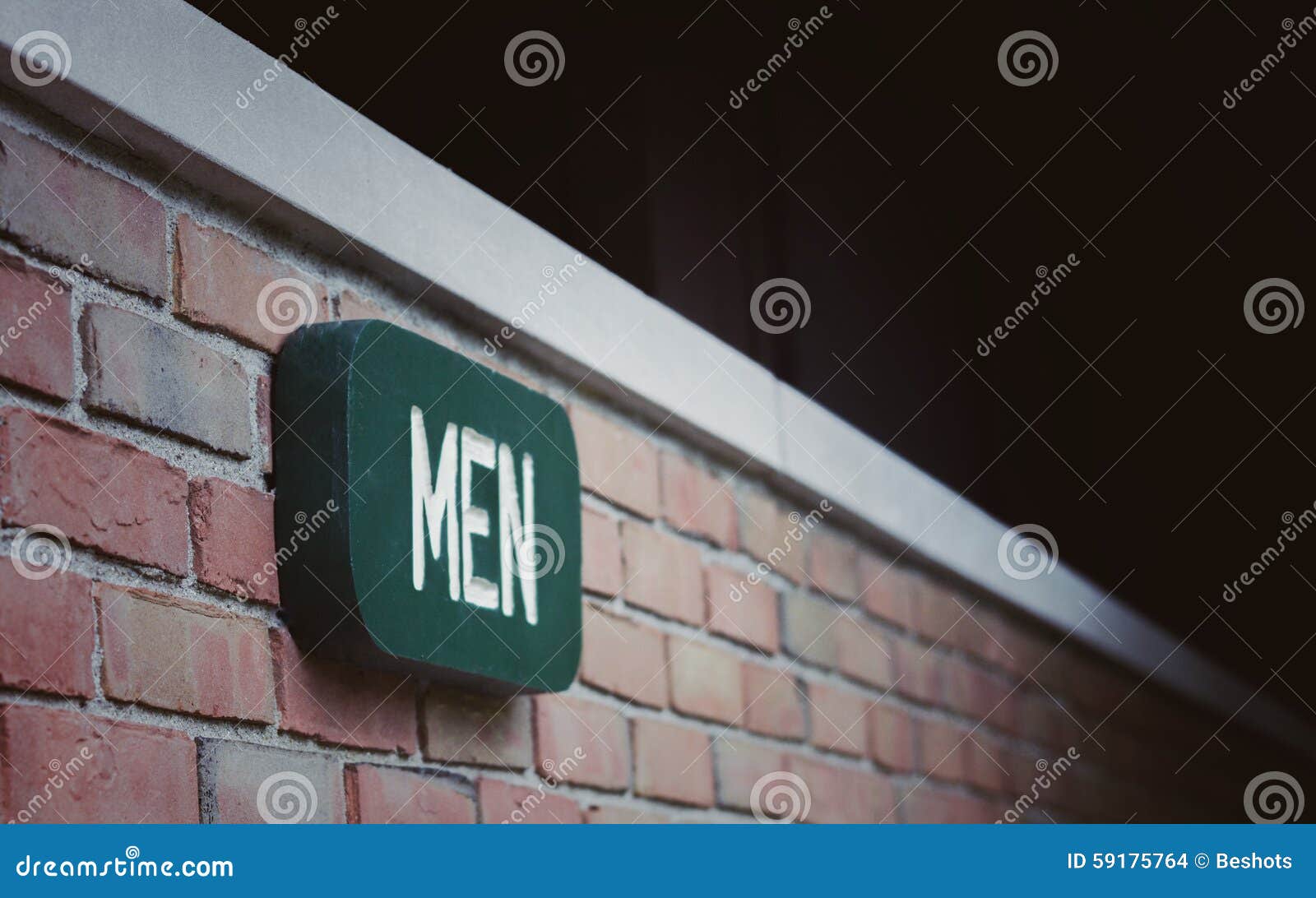 Men sign on brick wall stock photo. Image of cave, brick - 59175764