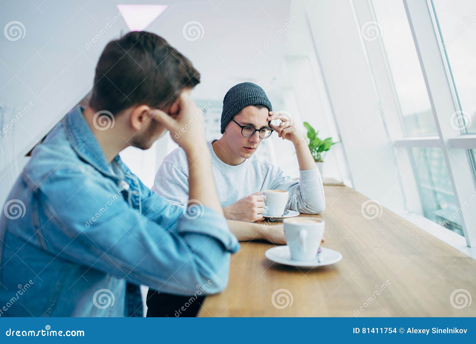 Men are Sitting in Front of the Table Near Window Stock Photo - Image ...