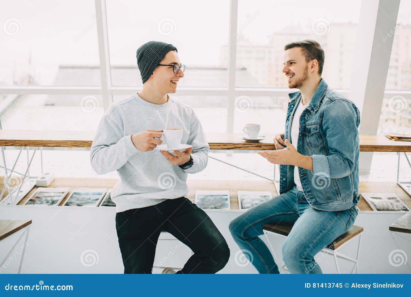 Men are Sitting in Front of the Table Near Window Stock Image - Image ...