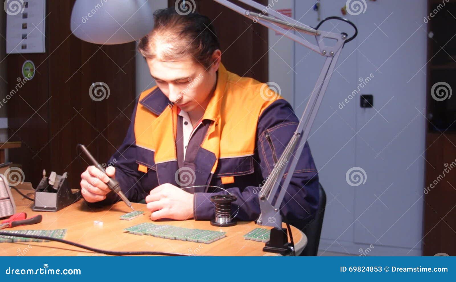 Men solder at the table stock video. Video of iron, close - 69824853