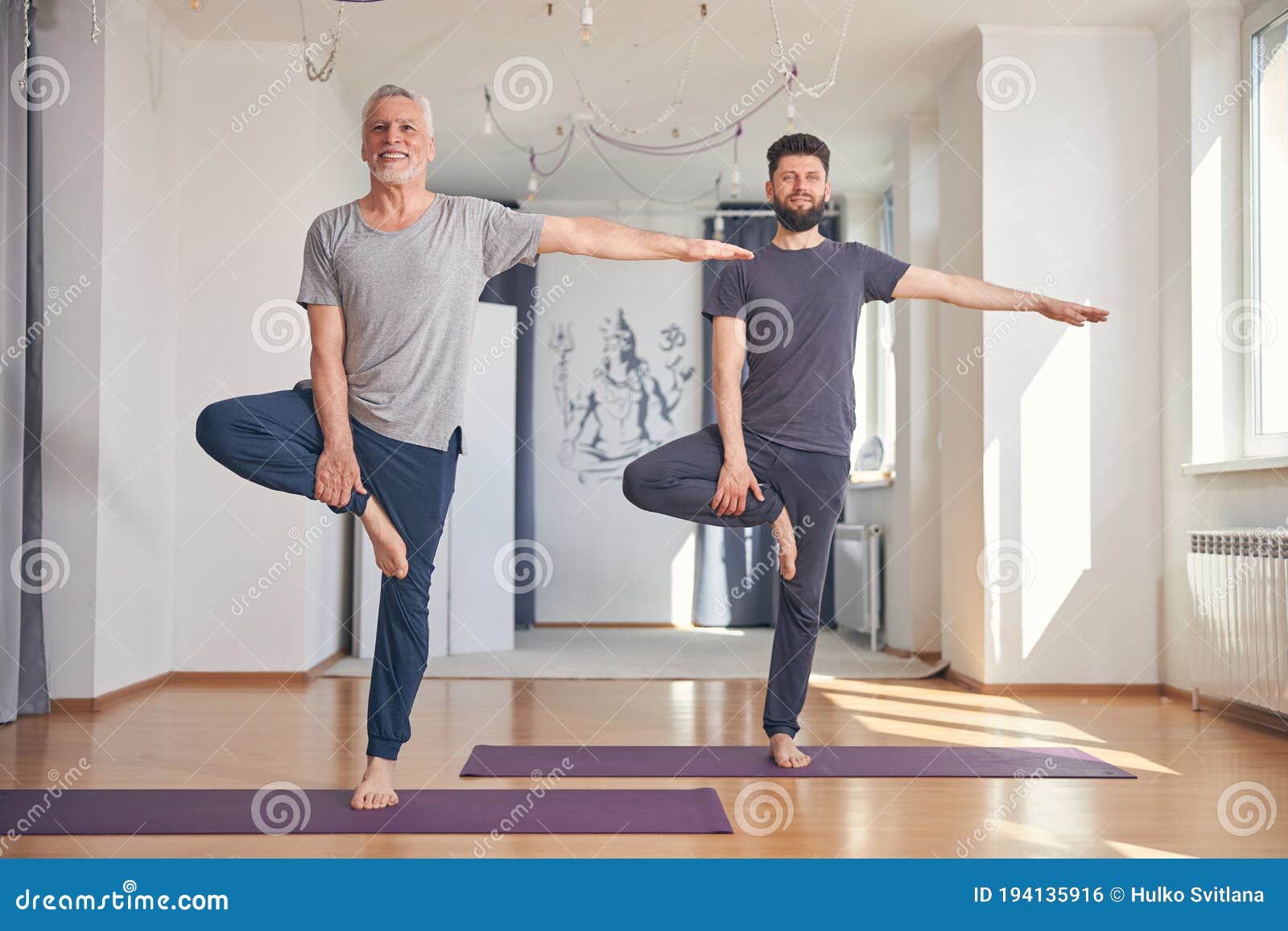 Men Standing on One Foot during the Balance Exercise Stock Photo ...