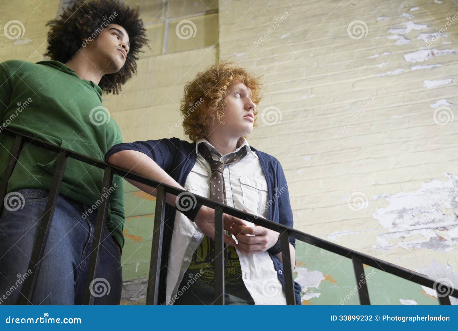 Men Standing by Railing Looking Away Stock Photo - Image of friendship ...