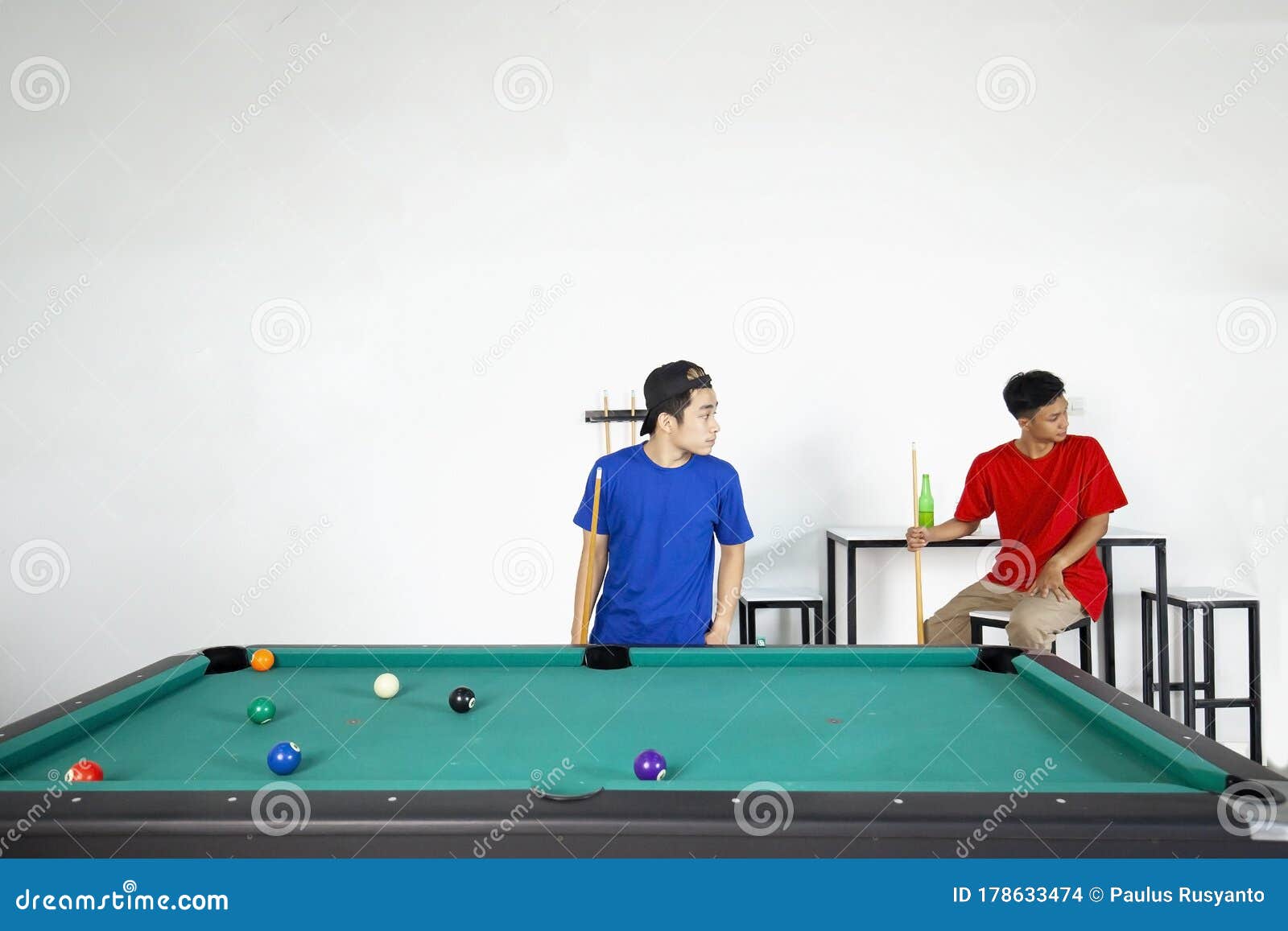 Men Standing and Sitting Near the Pool Table Stock Photo - Image of ...