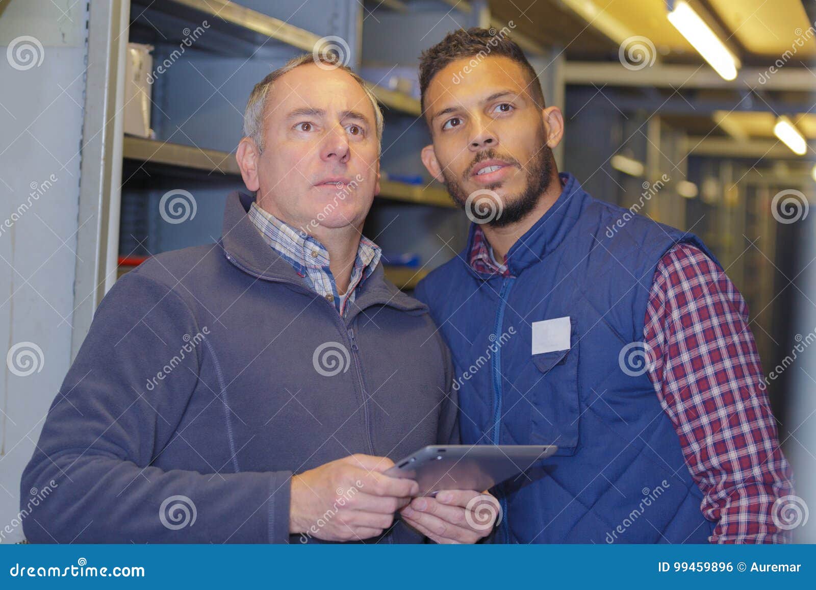 Men Staring at Something Inside Factory Stock Photo - Image of area ...