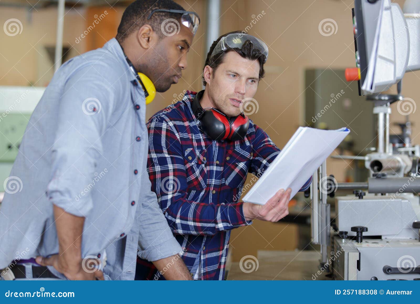 Men Stood by Factory Equipment Looking at Paperwork Stock Photo - Image ...