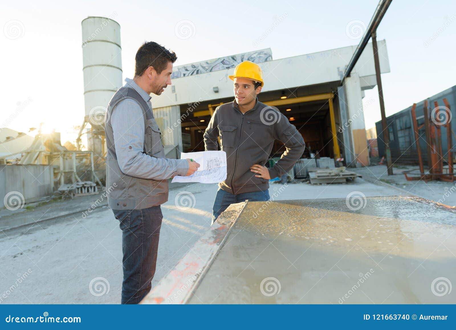 Men Stood Talking on Work Site Stock Photo - Image of building, helmet ...