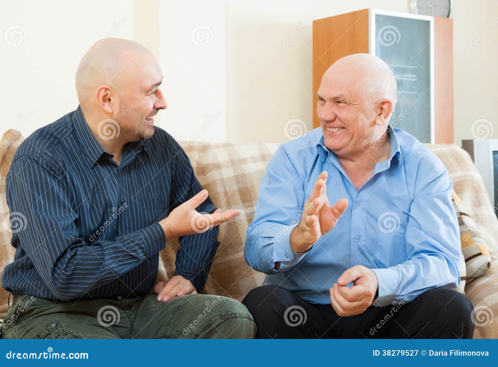 Men talking on couch stock image. Image of lifestyle - 38279527