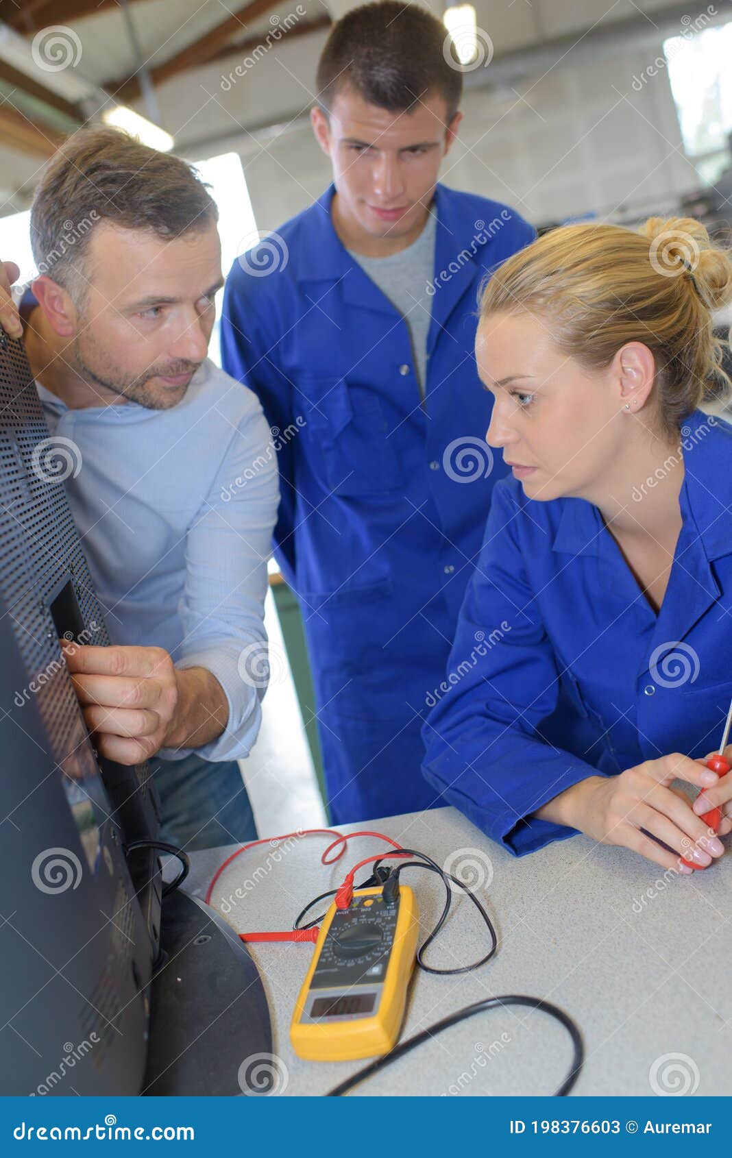 Man and Team Workers Adjusting Machine Stock Image - Image of ...